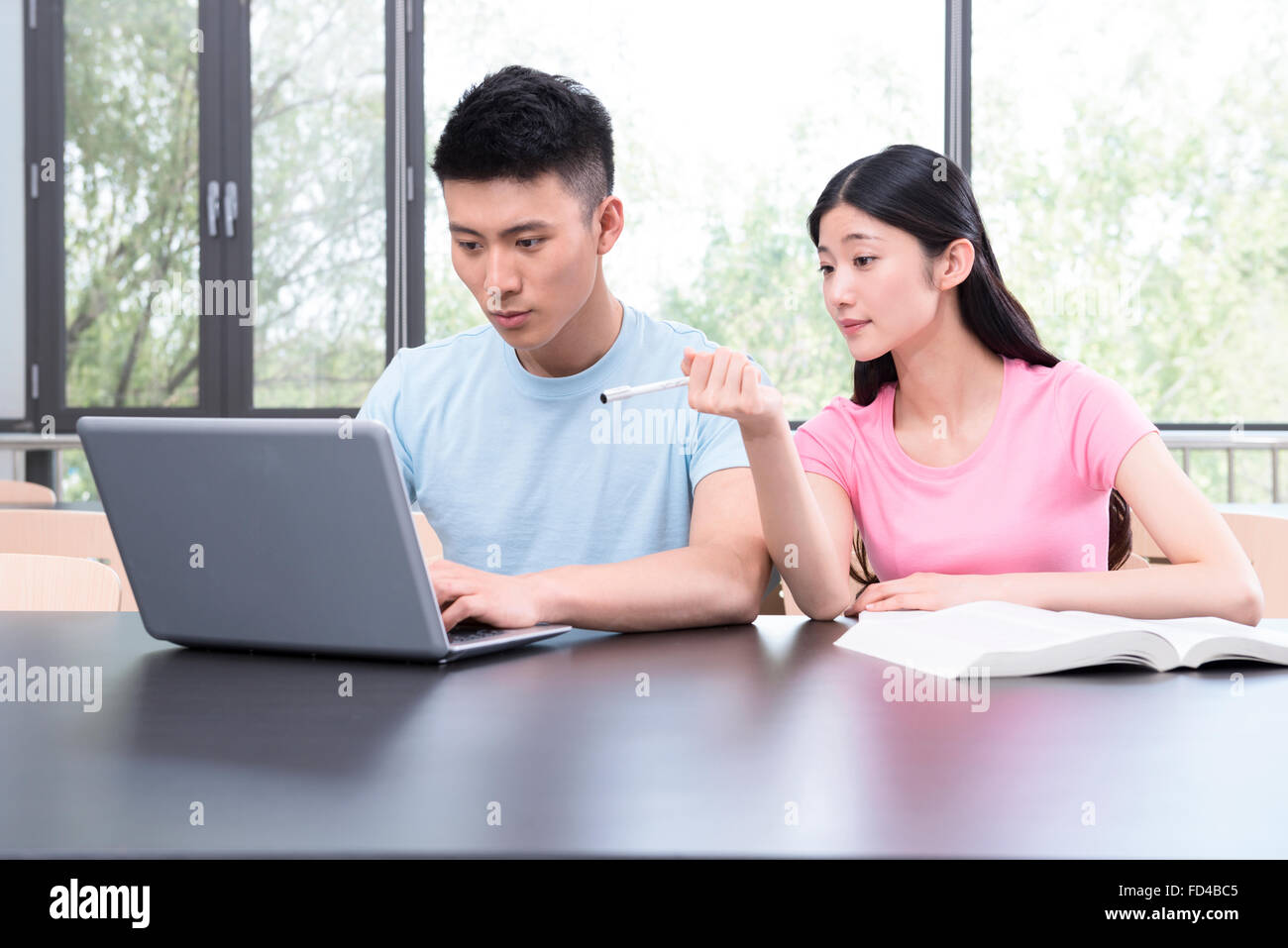College students studying in library Stock Photo - Alamy
