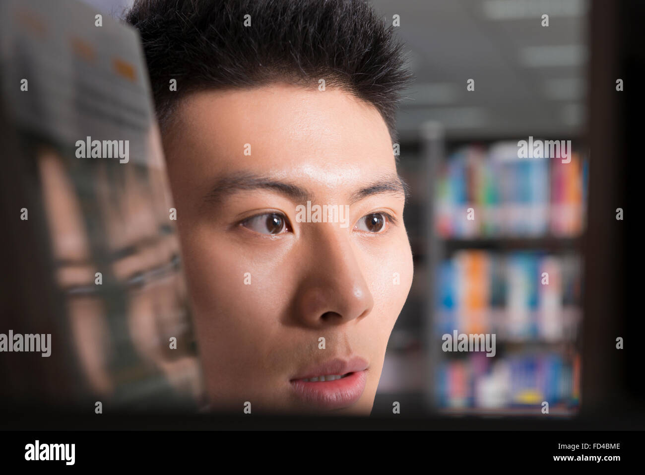 Portrait of college student in library Stock Photo - Alamy