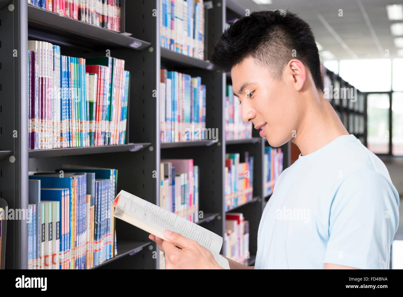 Asia man reading library hi-res stock photography and images - Alamy