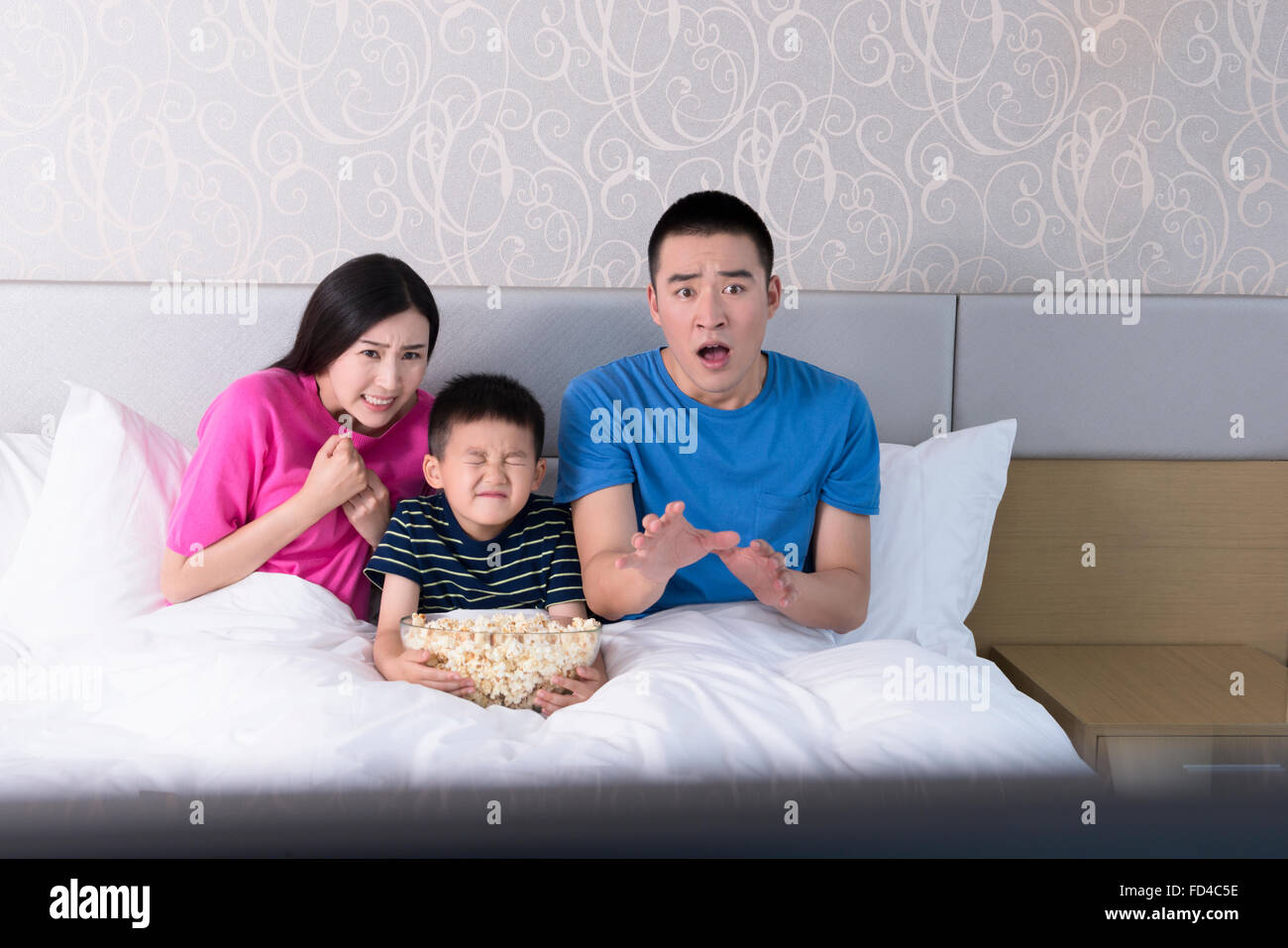 Movie in bed hi-res stock photography and images - Alamy