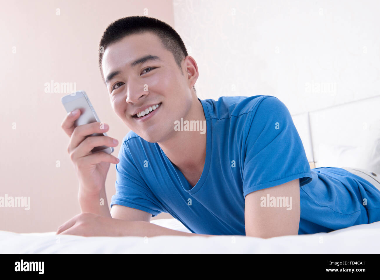 Young man looking camera using hi-res stock photography and images - Alamy