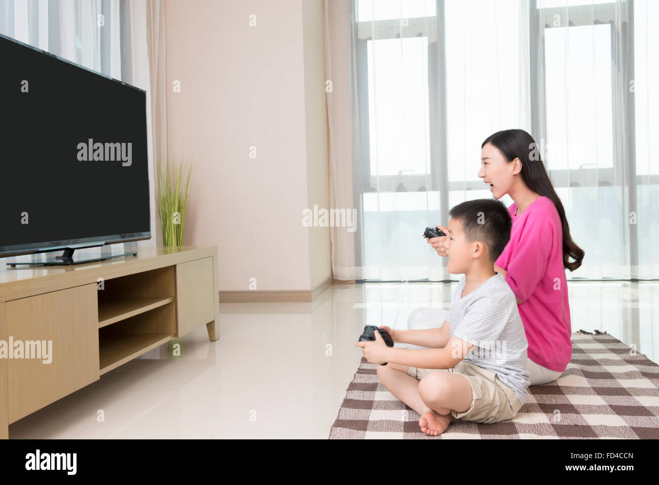Mother son playing video games hi-res stock photography and images - Alamy