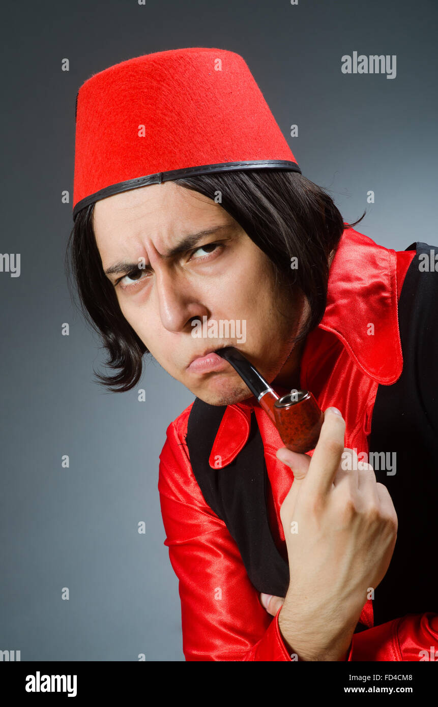 The man wearing red fez hat Stock Photo - Alamy