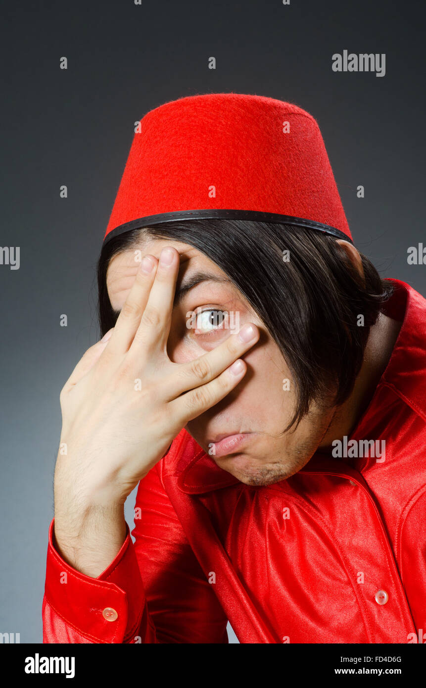 The man wearing red fez hat Stock Photo - Alamy
