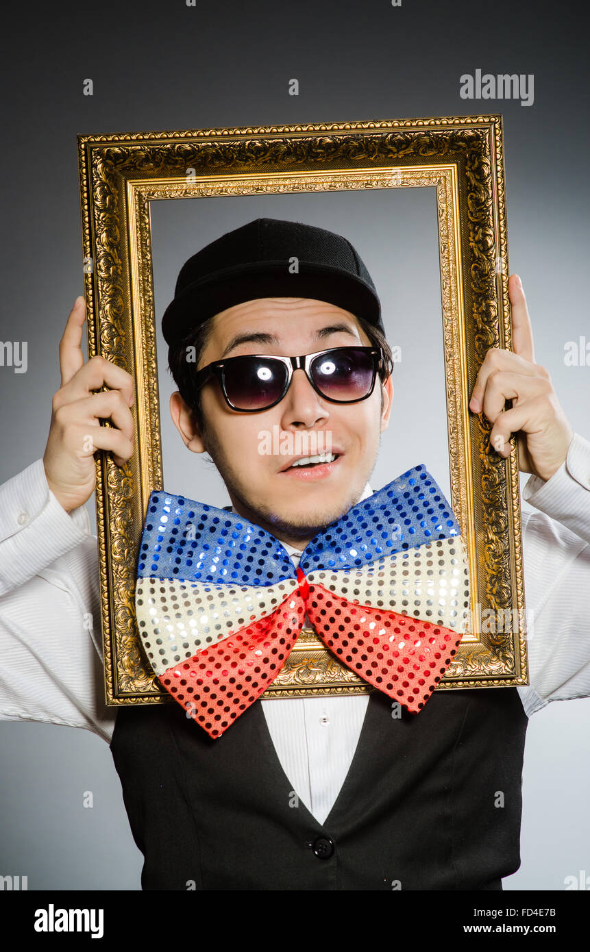 The funny man with picture frame Stock Photo - Alamy