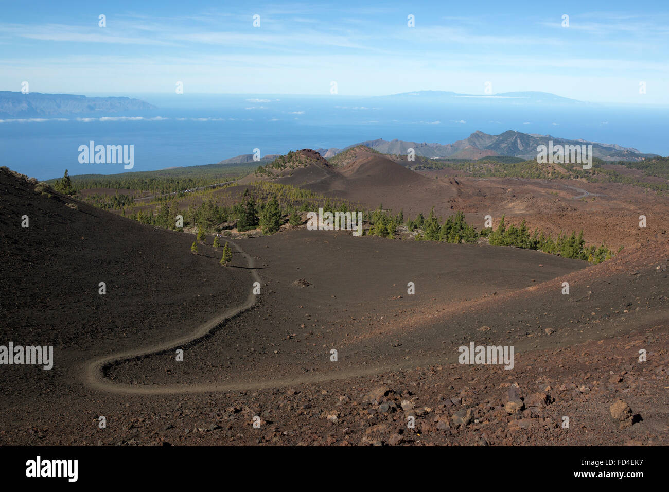 A walking trail snakes through volcanic rock on the Samara Volcano in ...