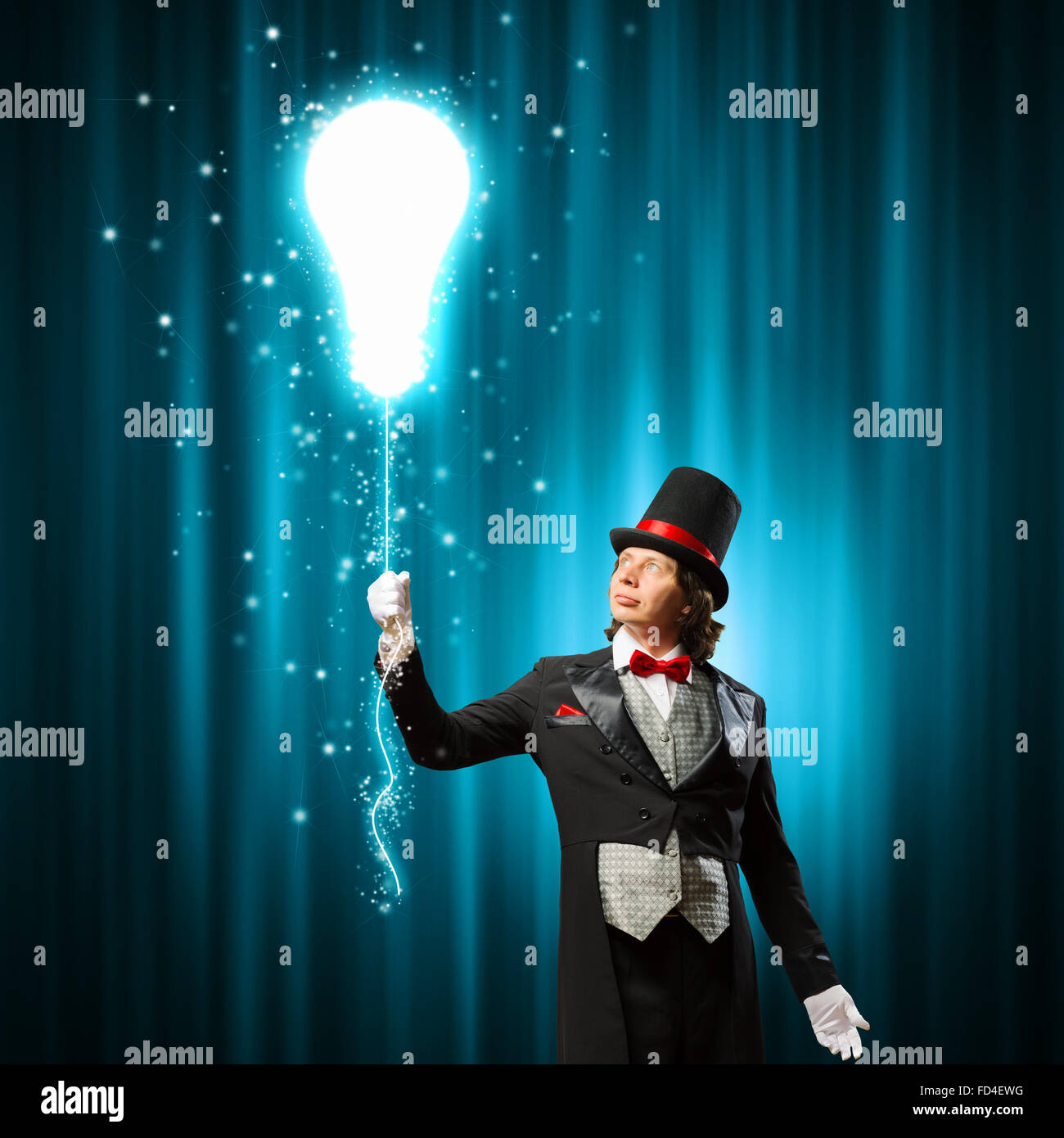 Image of man magician showing trick against color background Stock ...
