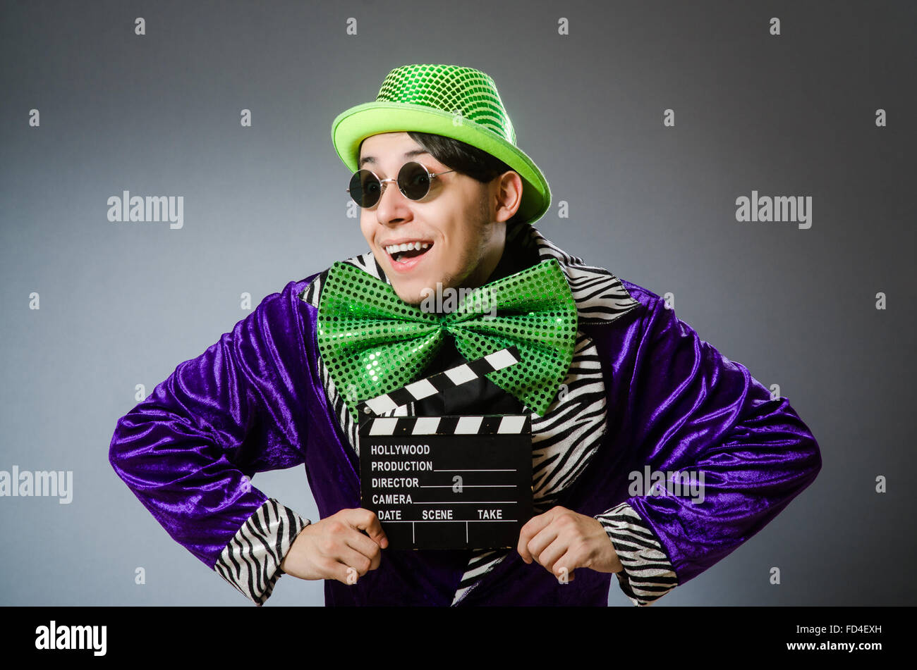 The funny man with movie clapboard Stock Photo - Alamy