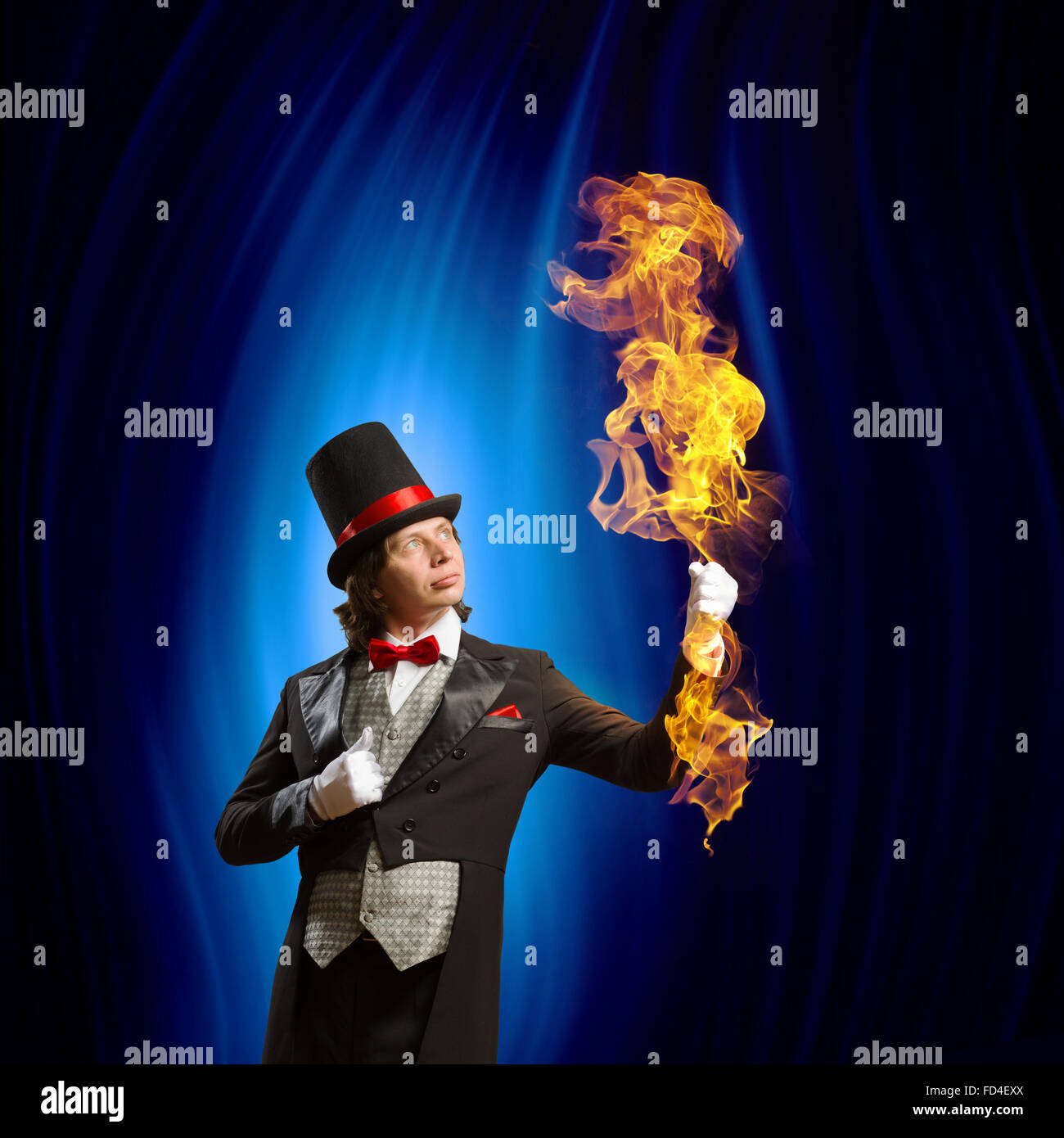 Image of man magician showing trick against color background Stock ...