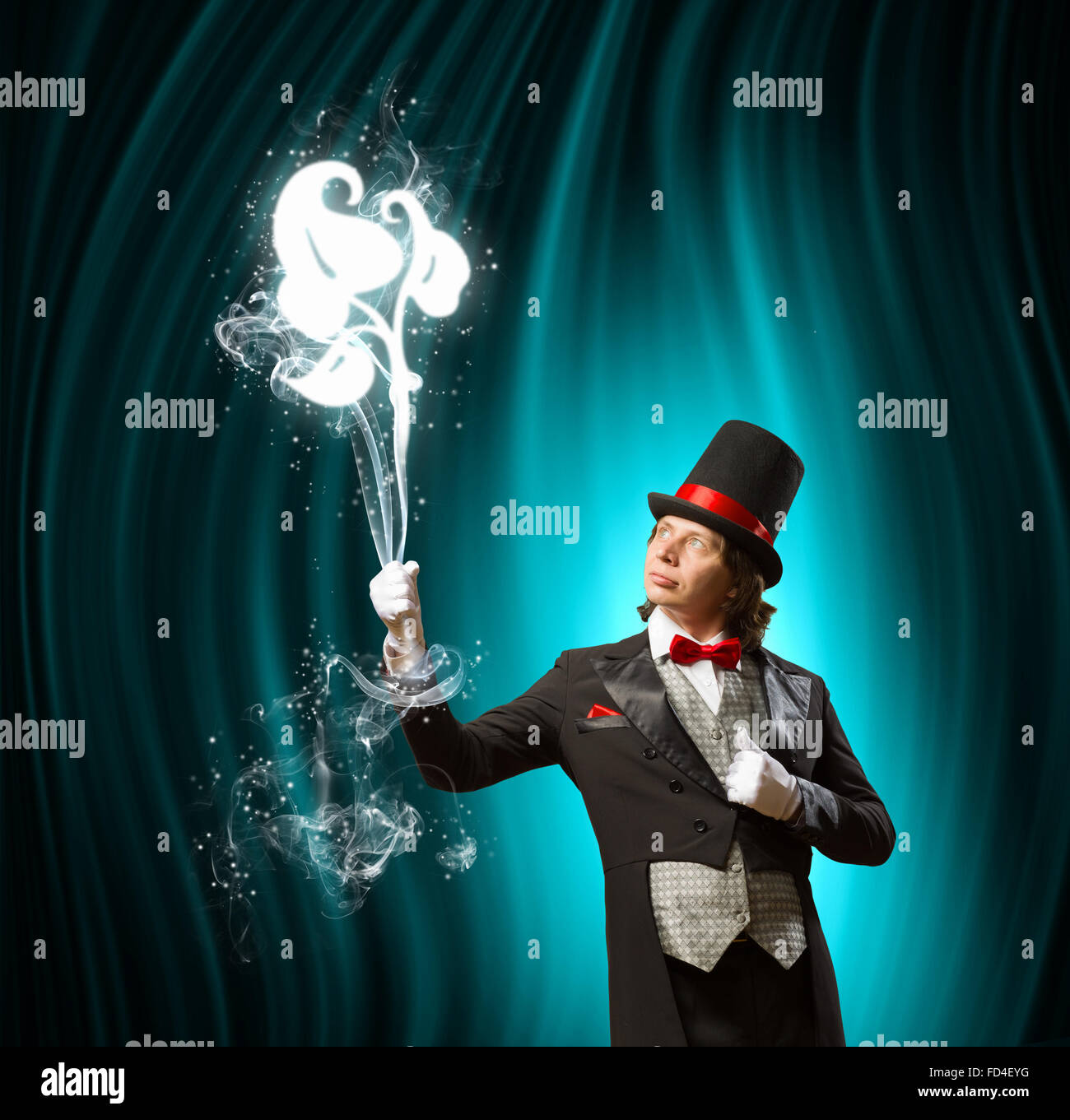 Image of man magician showing trick against color background Stock ...