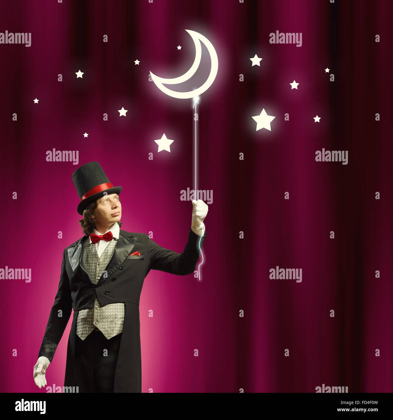 Image of man magician with balloon against color background Stock Photo ...
