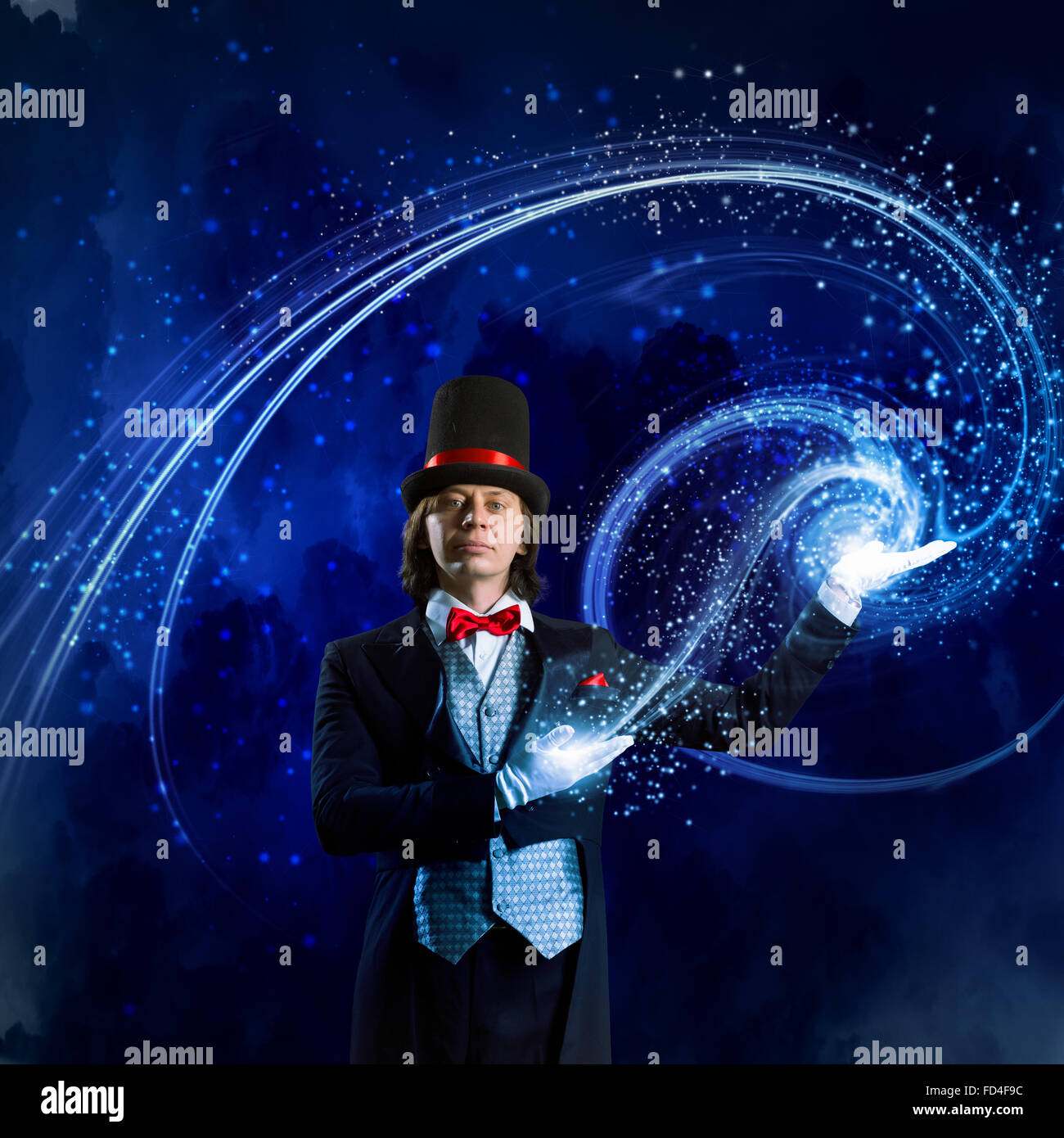 Image of wizard in red bow tie showing tricks Stock Photo - Alamy