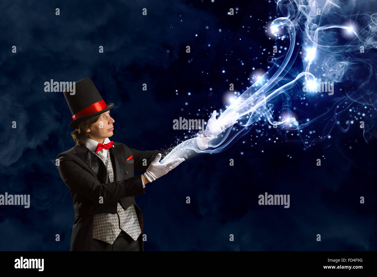 Image magician showing tricks magic hi-res stock photography and images ...