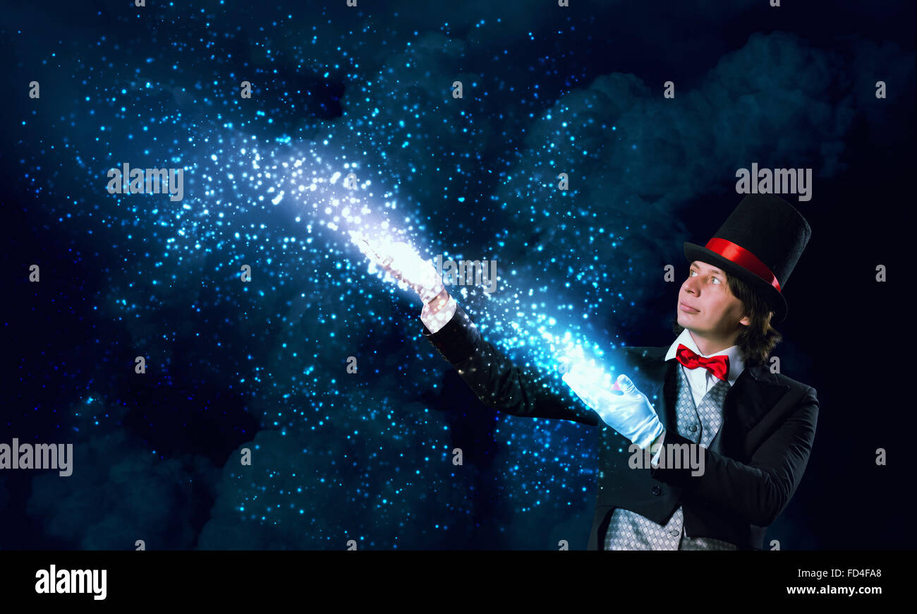 Image magician showing tricks magic hi-res stock photography and images ...