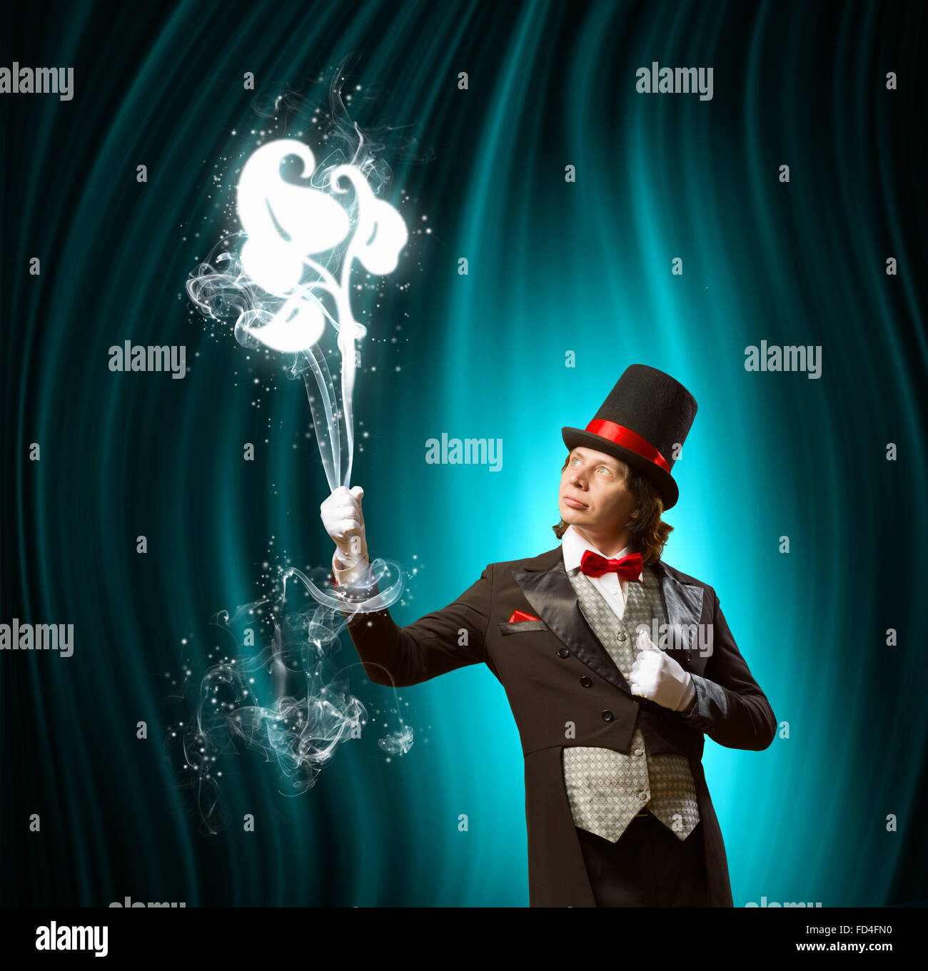 Magician trick wand hat flower hi-res stock photography and images - Alamy