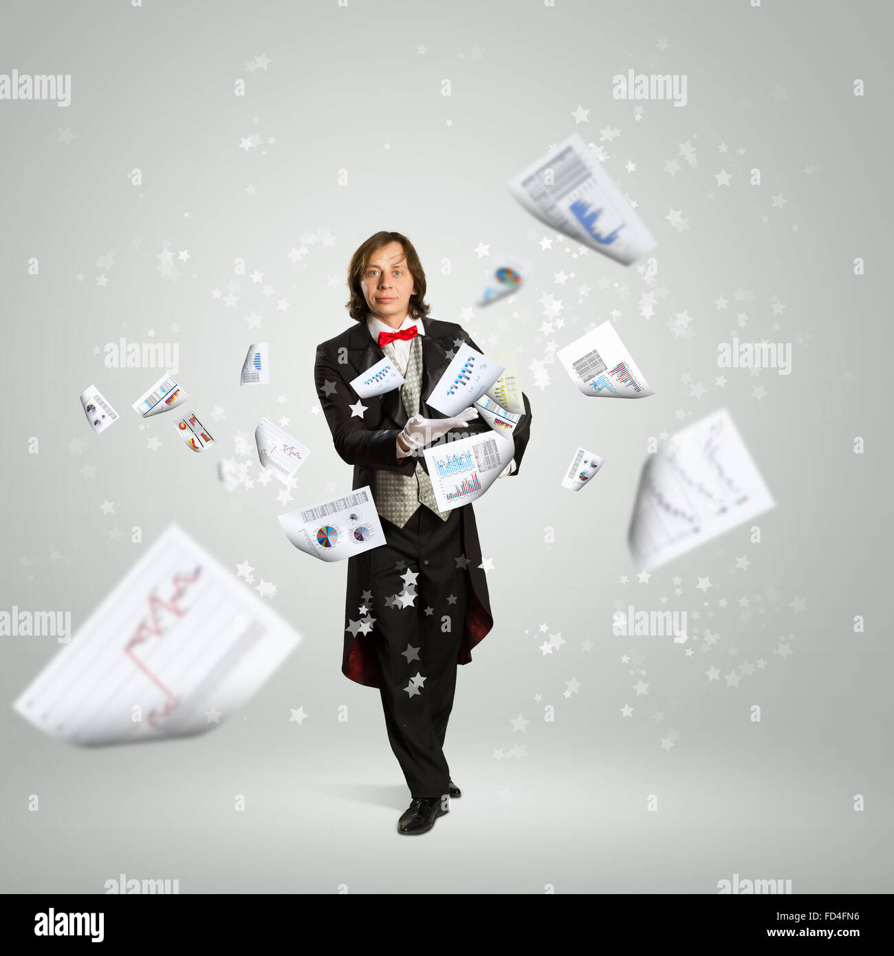 Image of magician and paper documents flying out of hat Stock Photo - Alamy