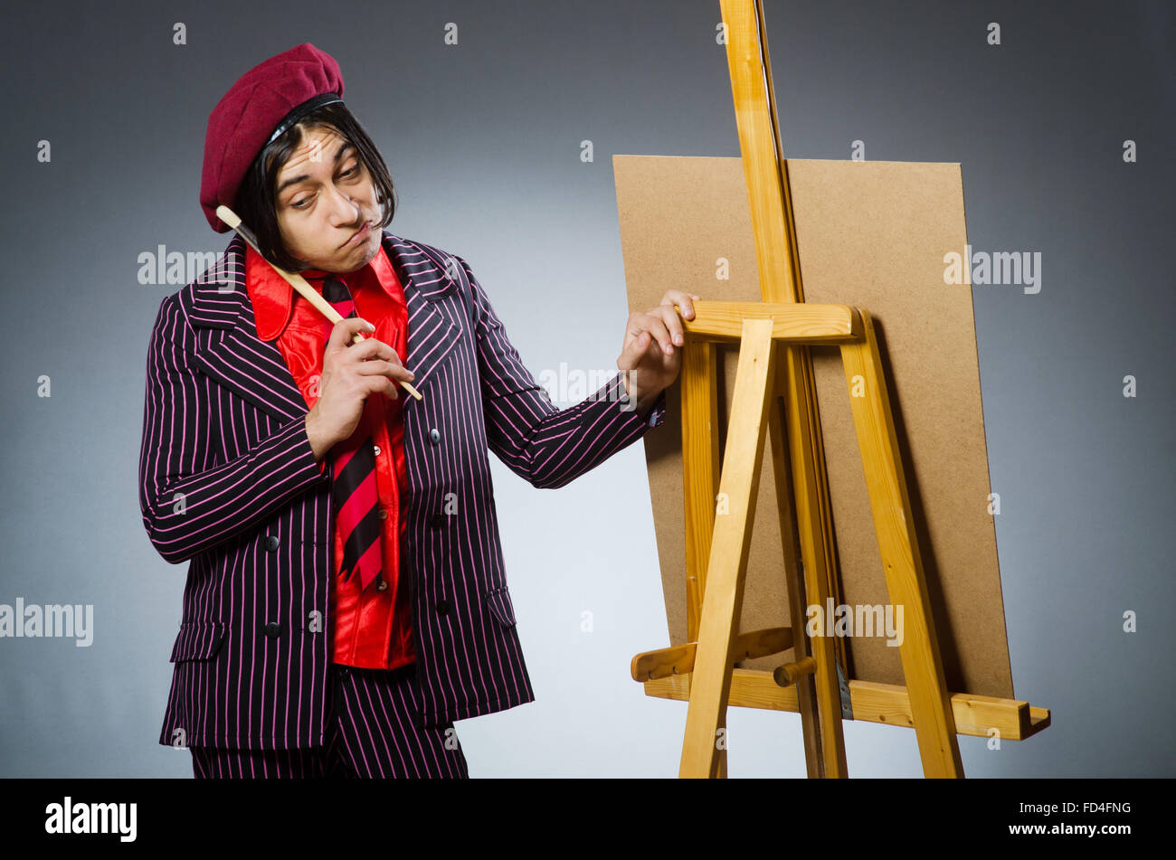 The funny artist with his artwork Stock Photo - Alamy