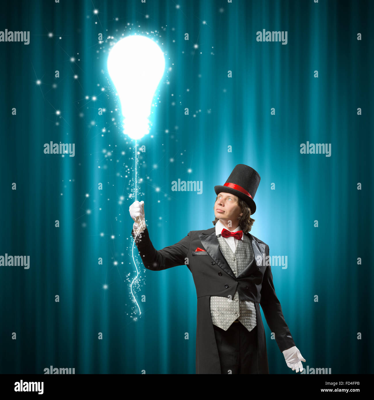 Image of man magician showing trick against color background Stock ...