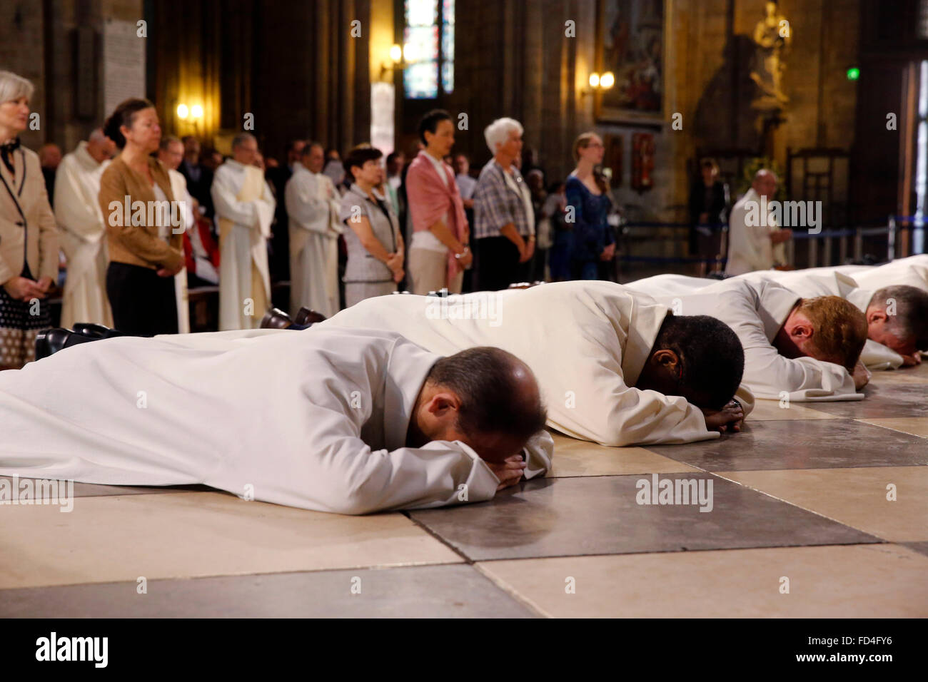 Deacon ordinations in Notre Dame cathedral, Paris. Deacons' wives ...