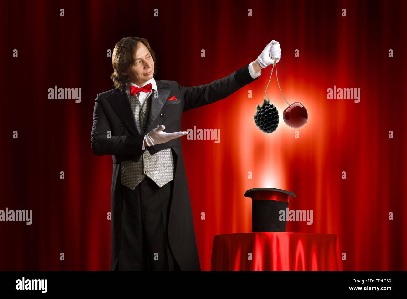 Image of magician showing tricks with hat Stock Photo - Alamy