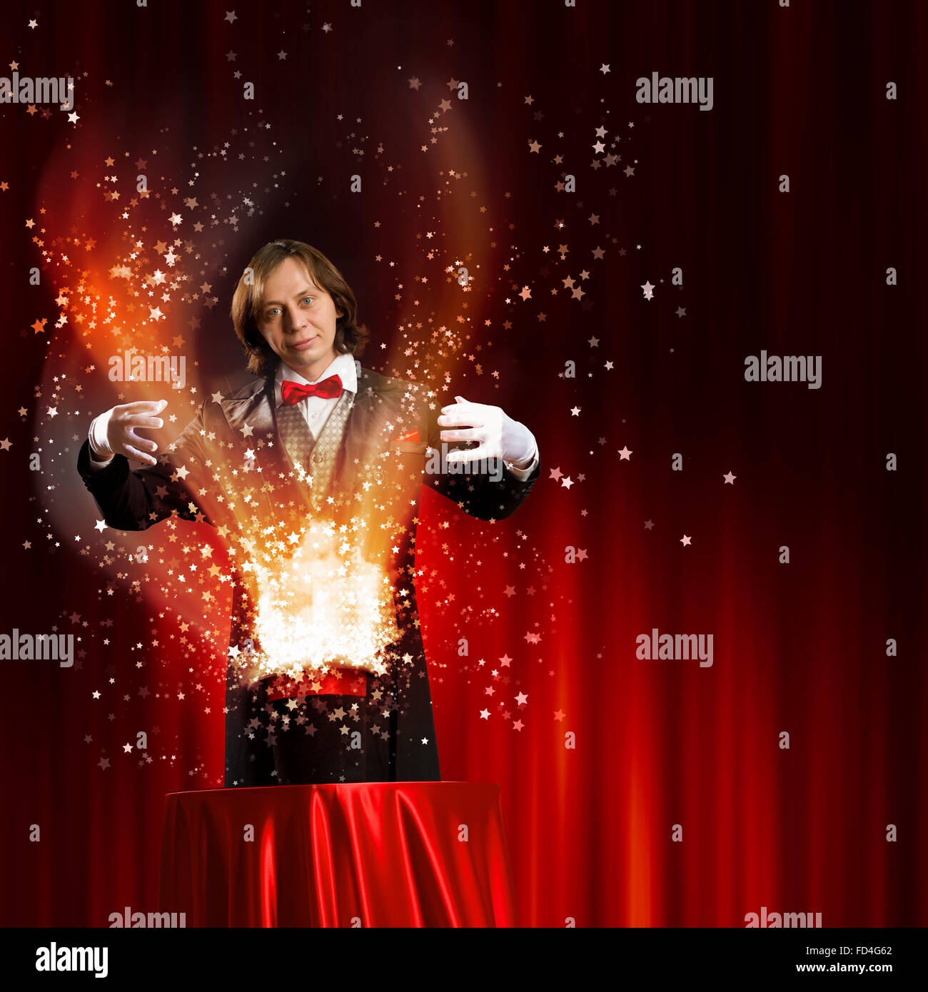 Image of magician holding hat with lights and fumes going out Stock ...