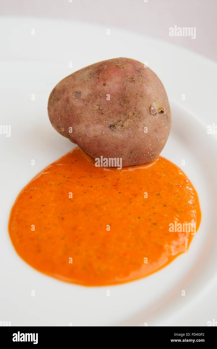 Potatoe (papas arrugadas) and mojo rojo served in Tenerife, Spain. The ...