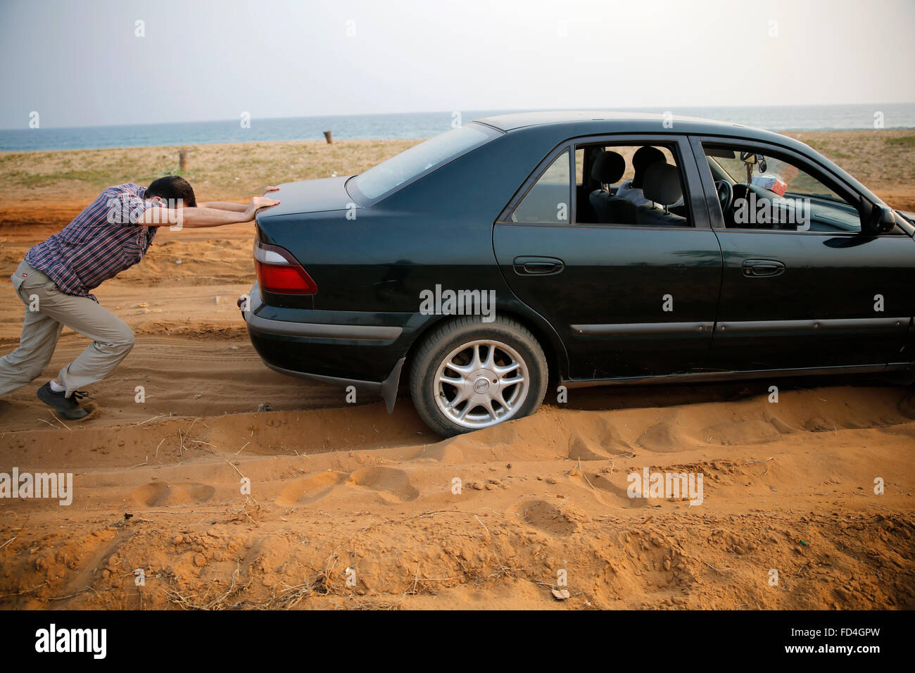 Pushing a car hi-res stock photography and images - Alamy