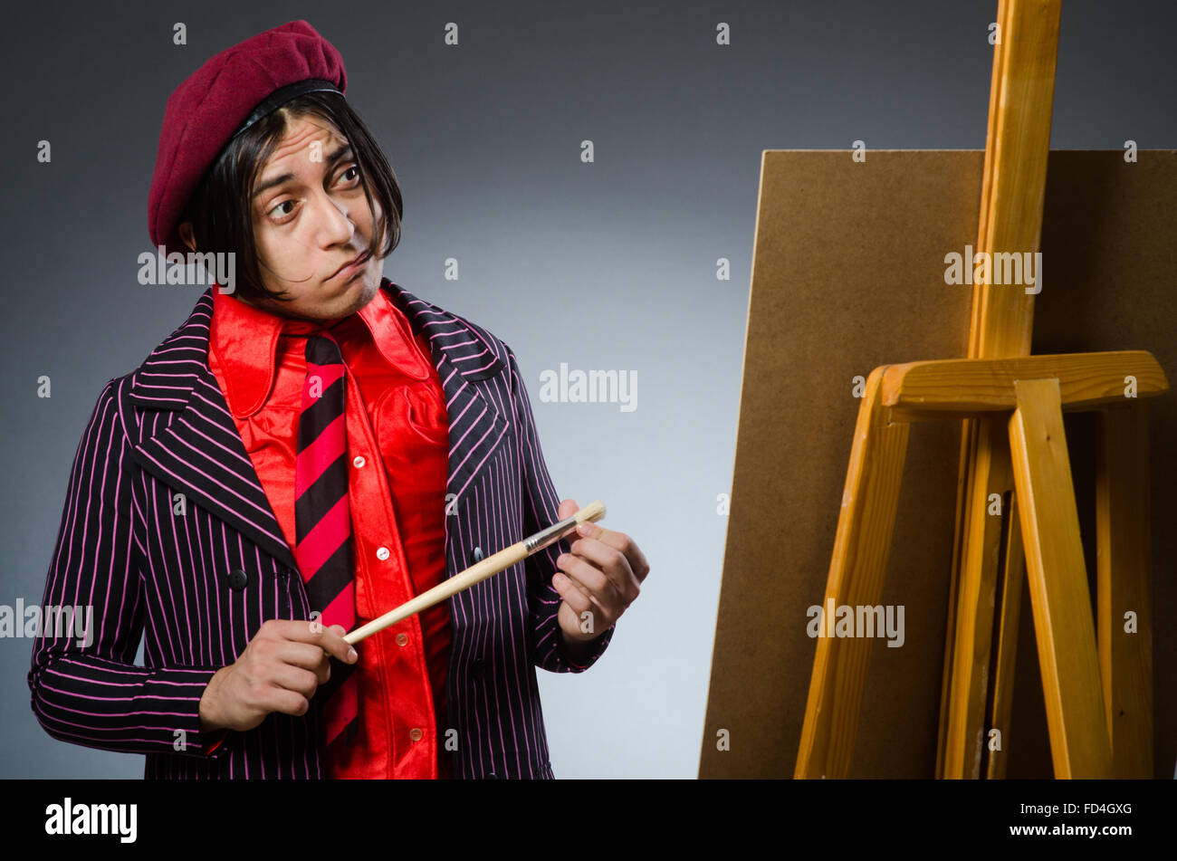 The funny artist with his artwork Stock Photo - Alamy