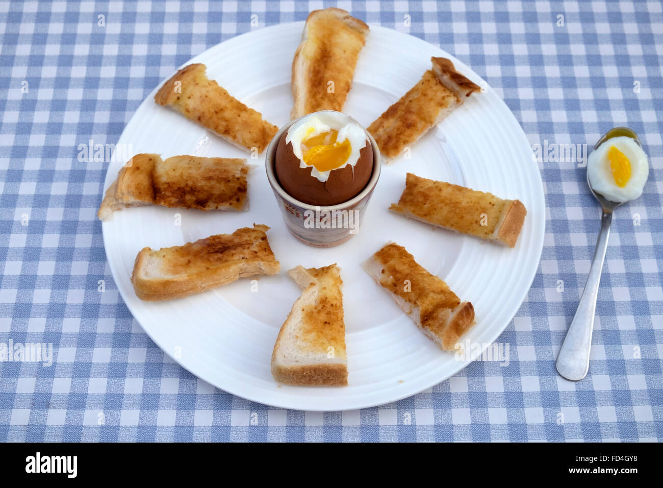 Soft boiled organic egg with toasted bread soldiers Stock Photo - Alamy