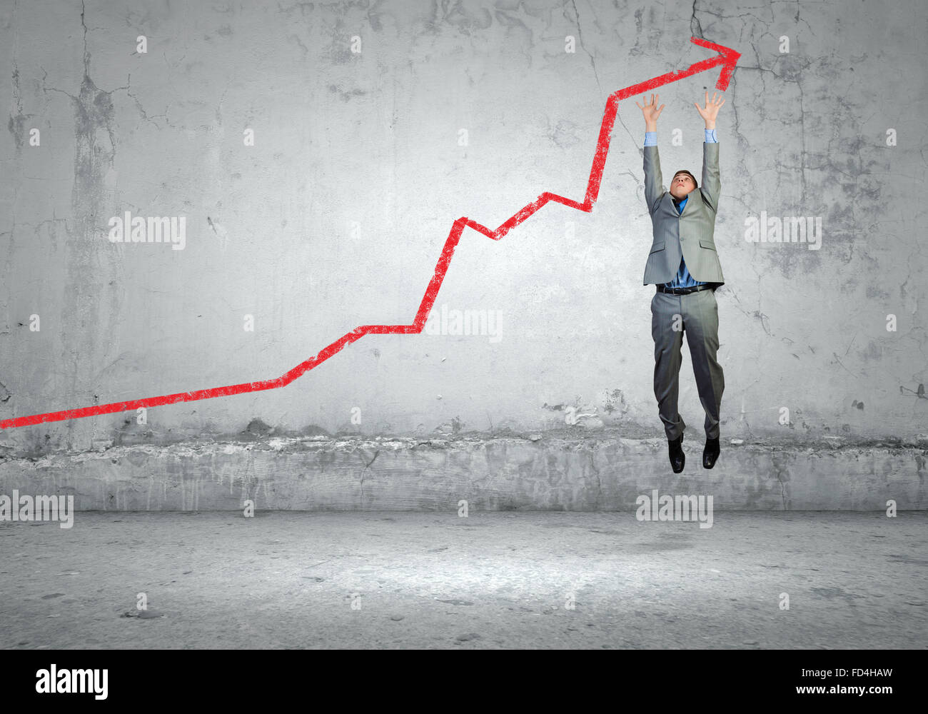 Image of jumping businessman trying to catch arrow of graph Stock Photo ...