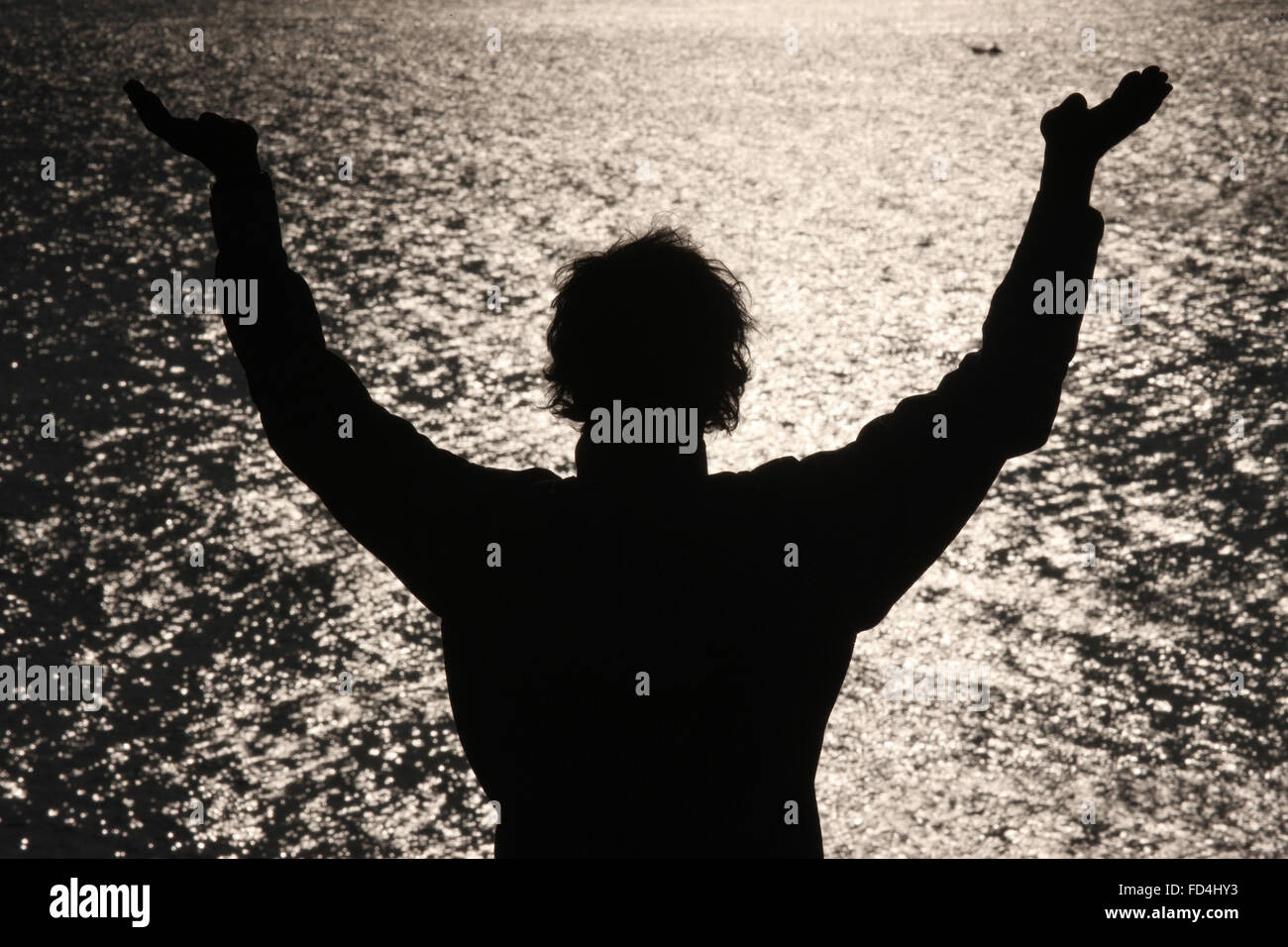 Praying at the seaside Stock Photo - Alamy