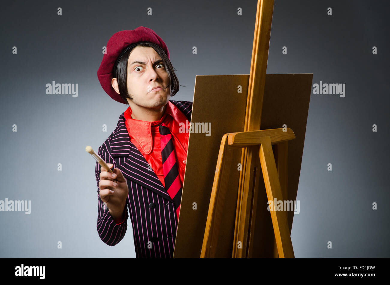 The funny artist with his artwork Stock Photo - Alamy