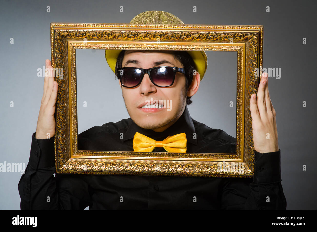 The funny man with picture frame Stock Photo - Alamy