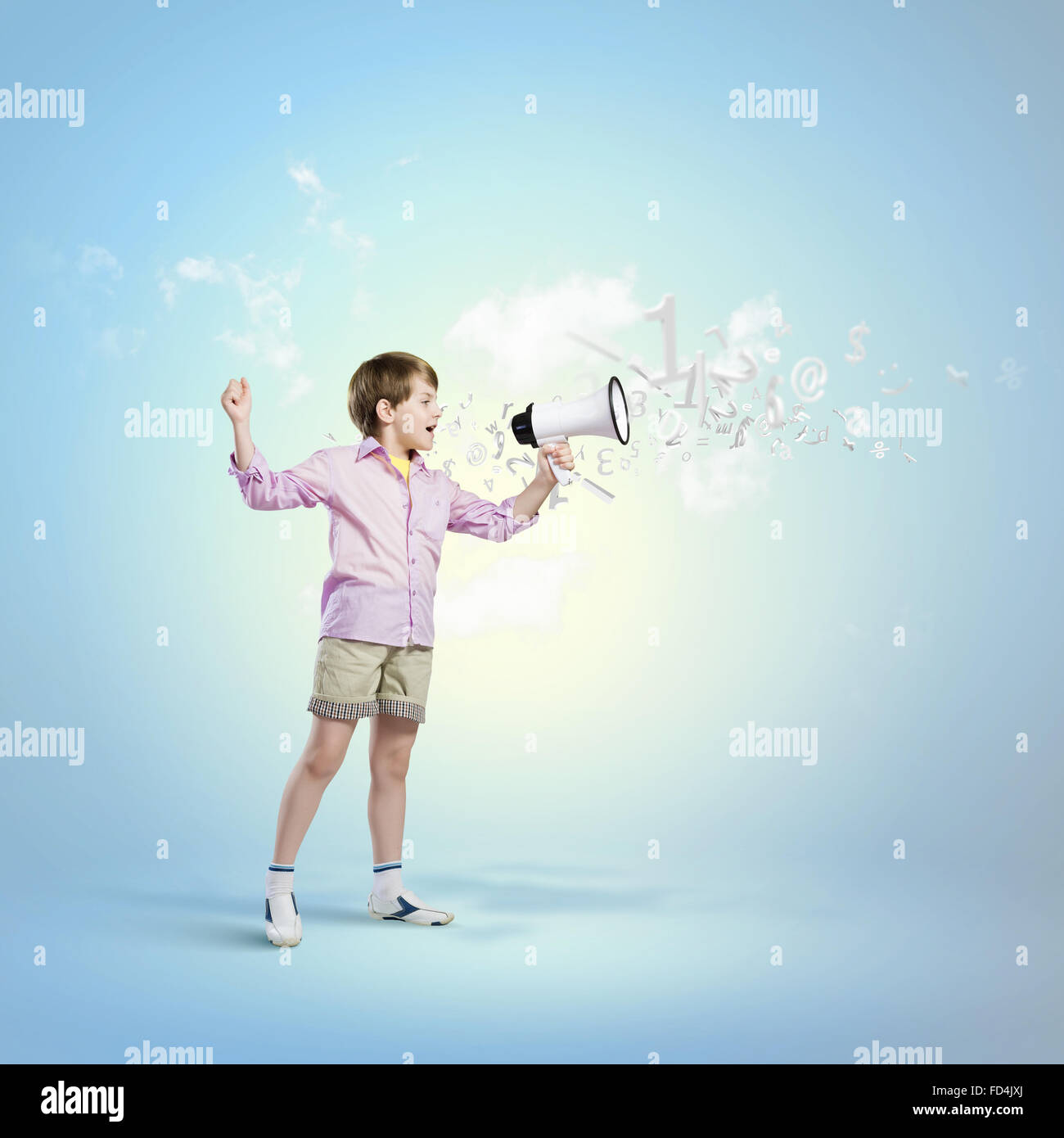 Image of little cute boy shouting in megaphone Stock Photo - Alamy