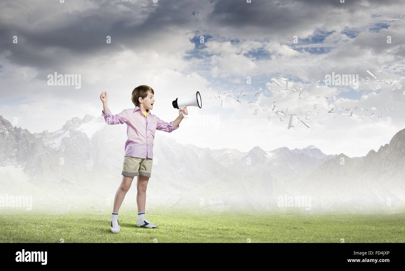 Image of little cute boy shouting in megaphone Stock Photo - Alamy