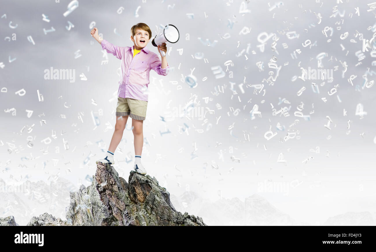 Image of little cute boy shouting in megaphone Stock Photo - Alamy