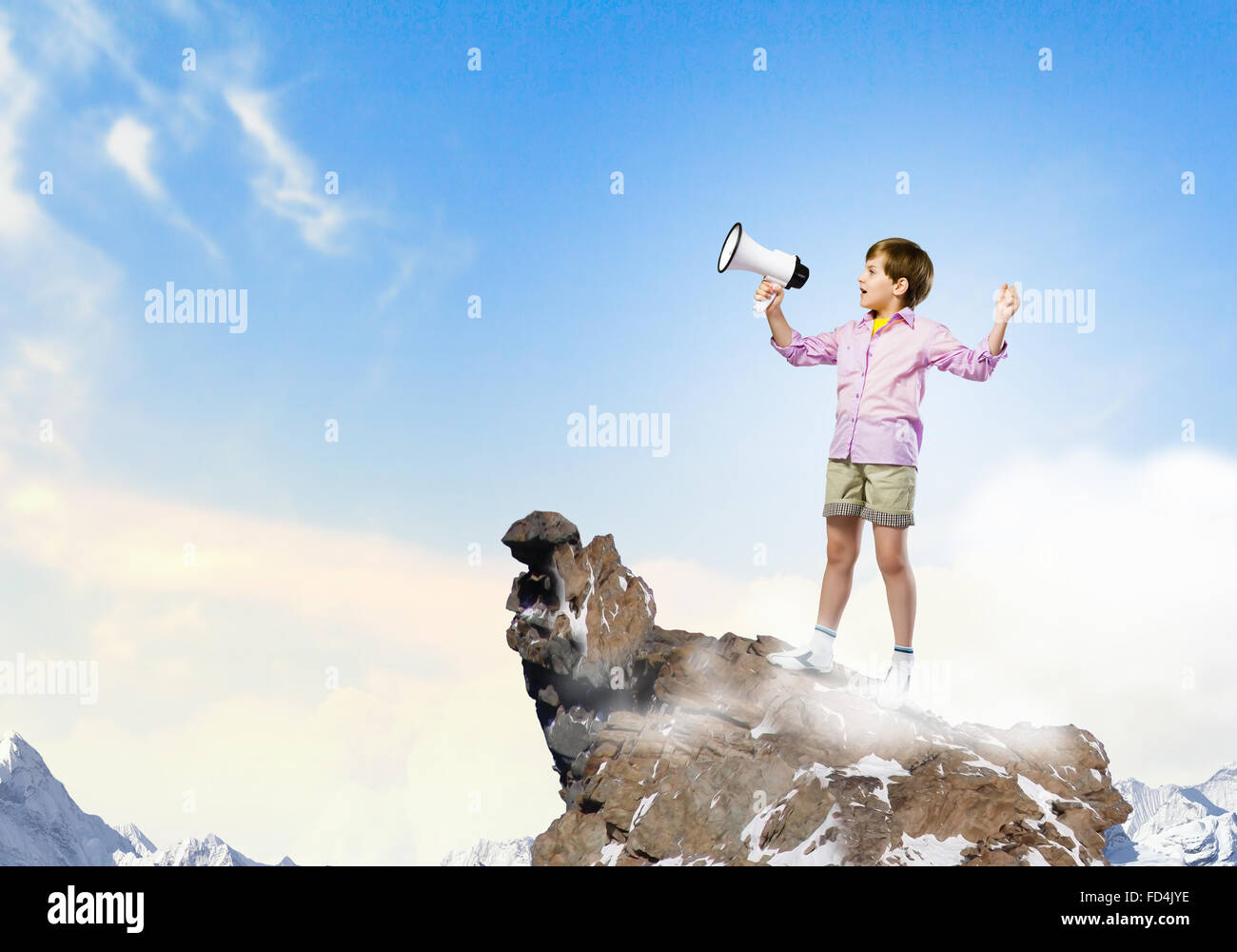 Image of little cute boy shouting in megaphone Stock Photo - Alamy