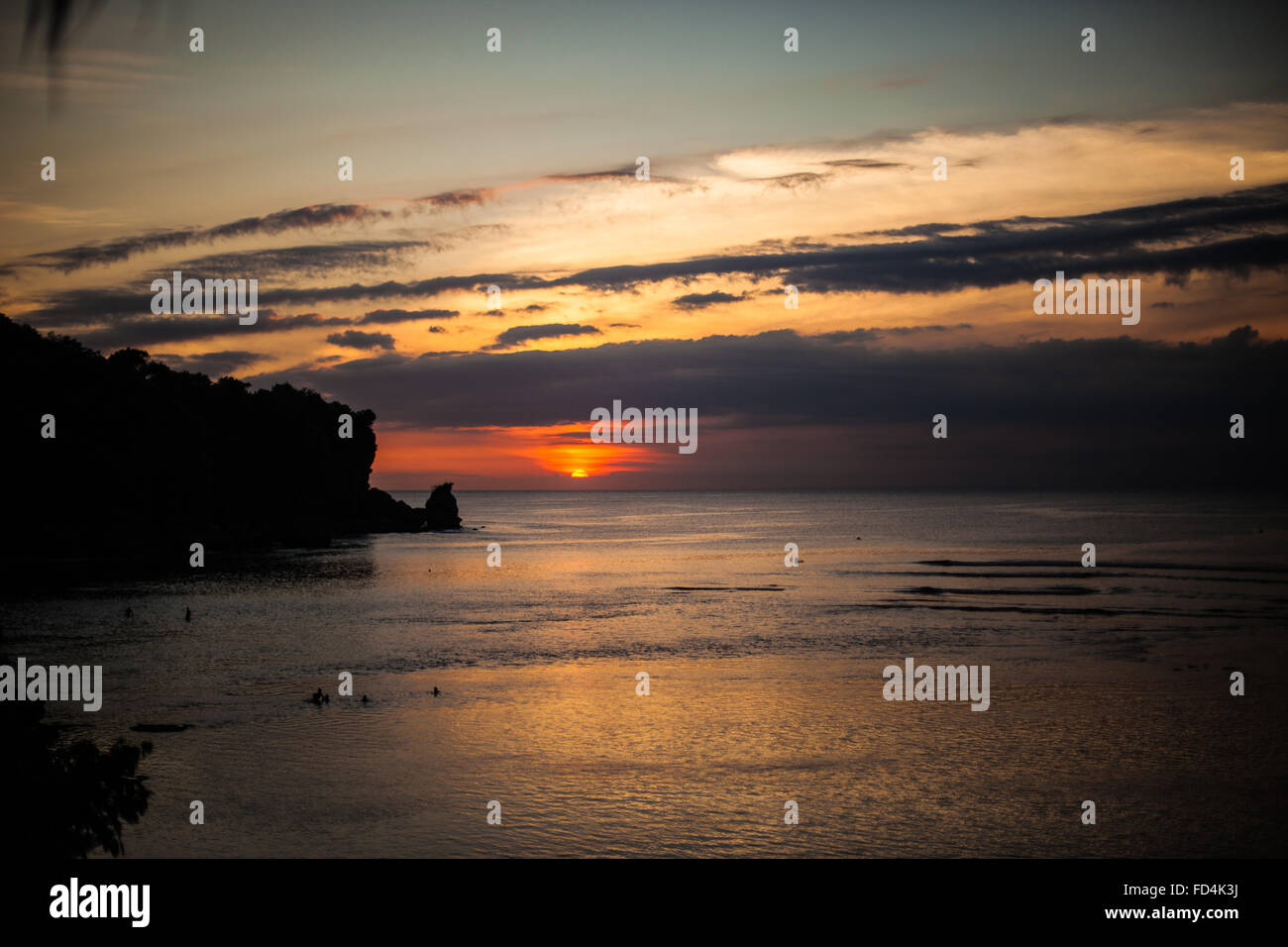 Sun Setting Over Sea Stock Photo - Alamy