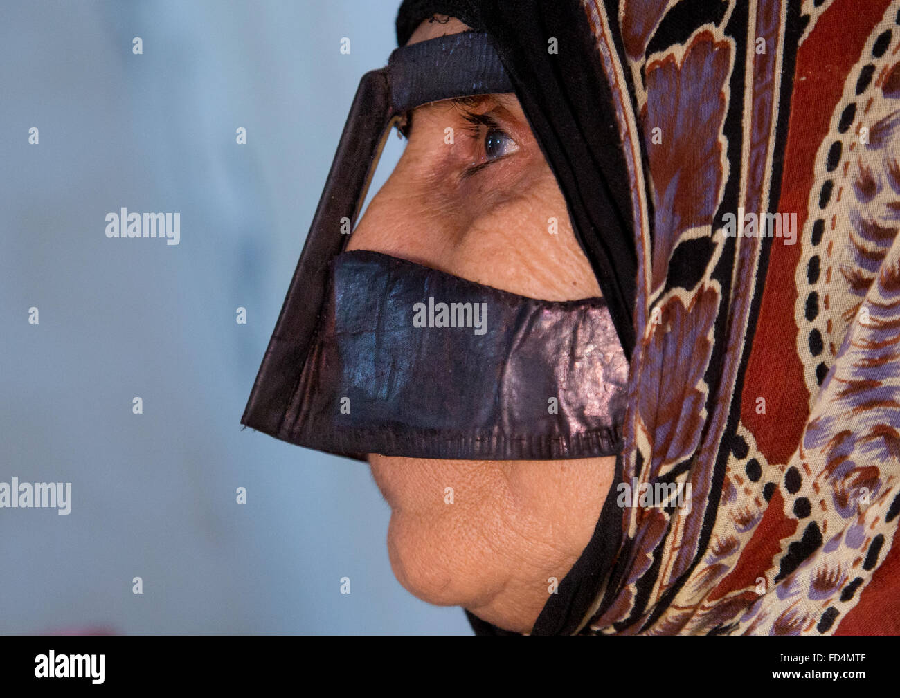 a bandari woman wearing a traditional mask called the burqa, Qeshm ...