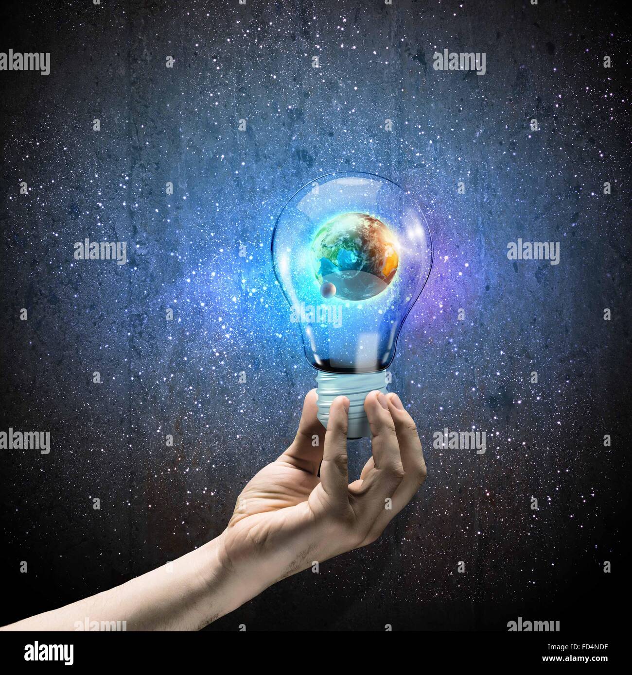Holding light bulb earth inside hi-res stock photography and images - Alamy