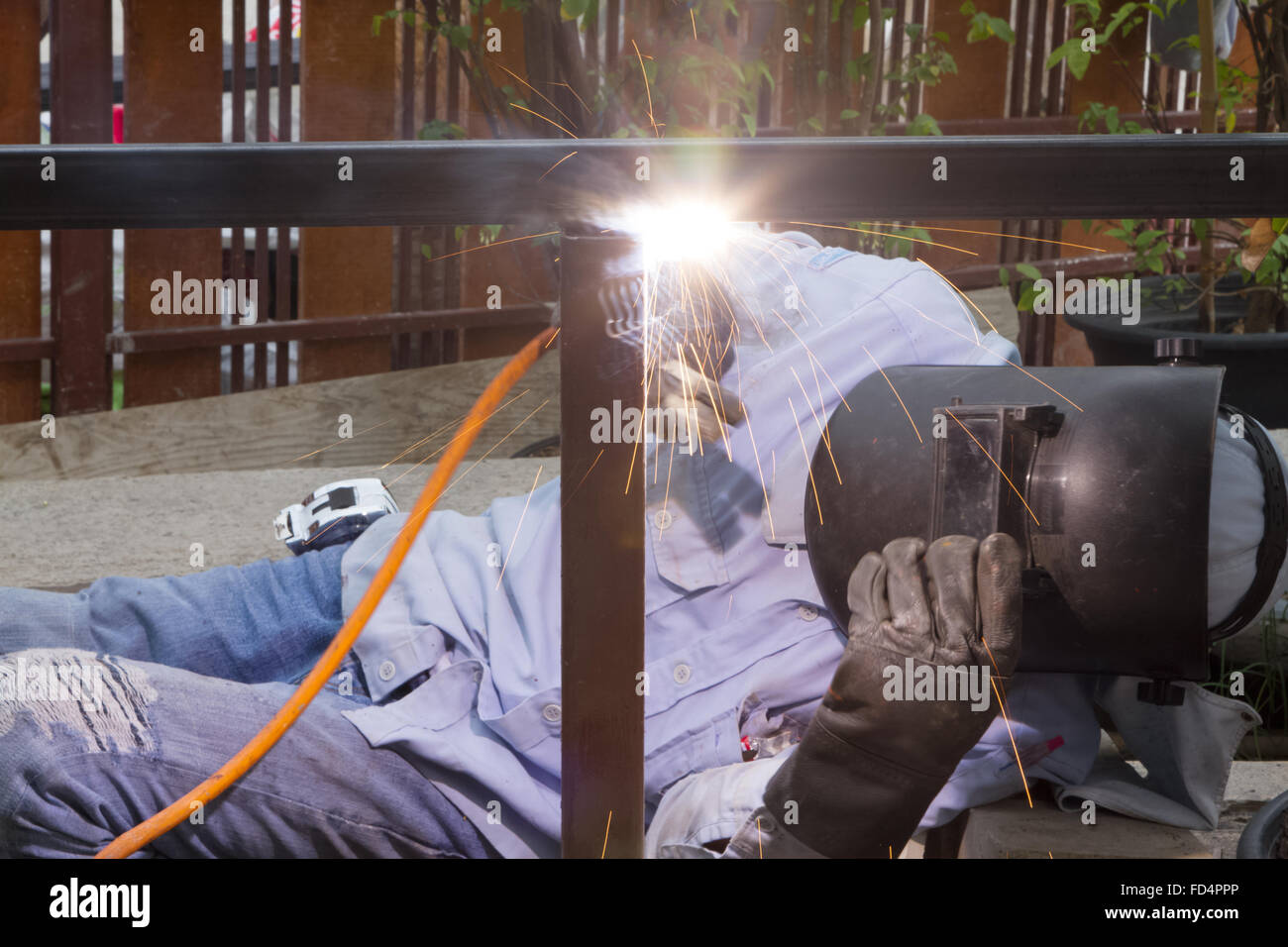 Industrial worker welding steel pipe flange,a spark welding Stock Photo ...