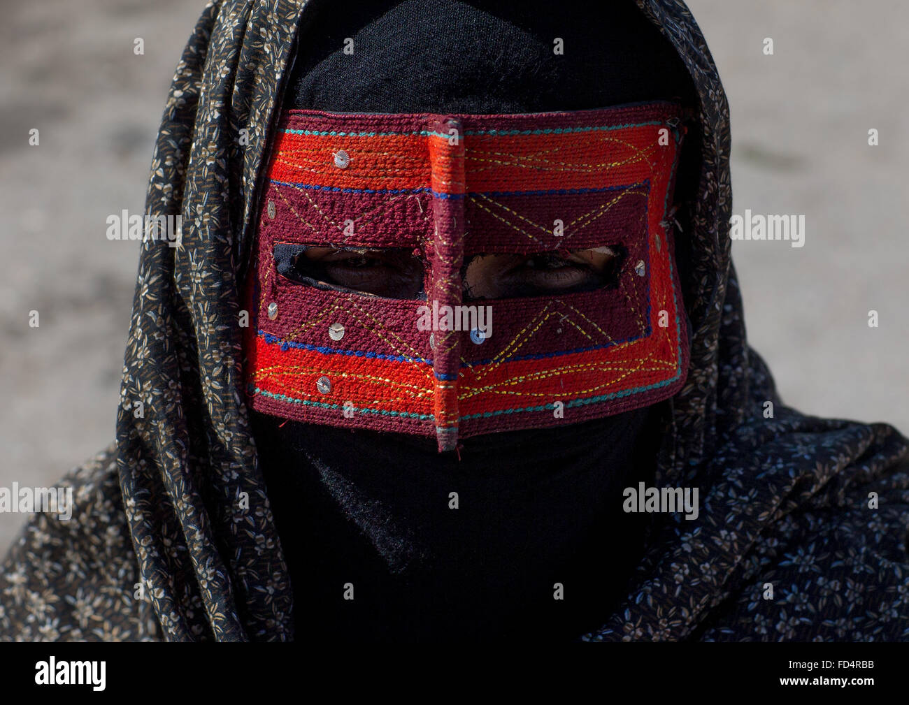 a bandari woman wearing the traditional mask called the burqa on a ...