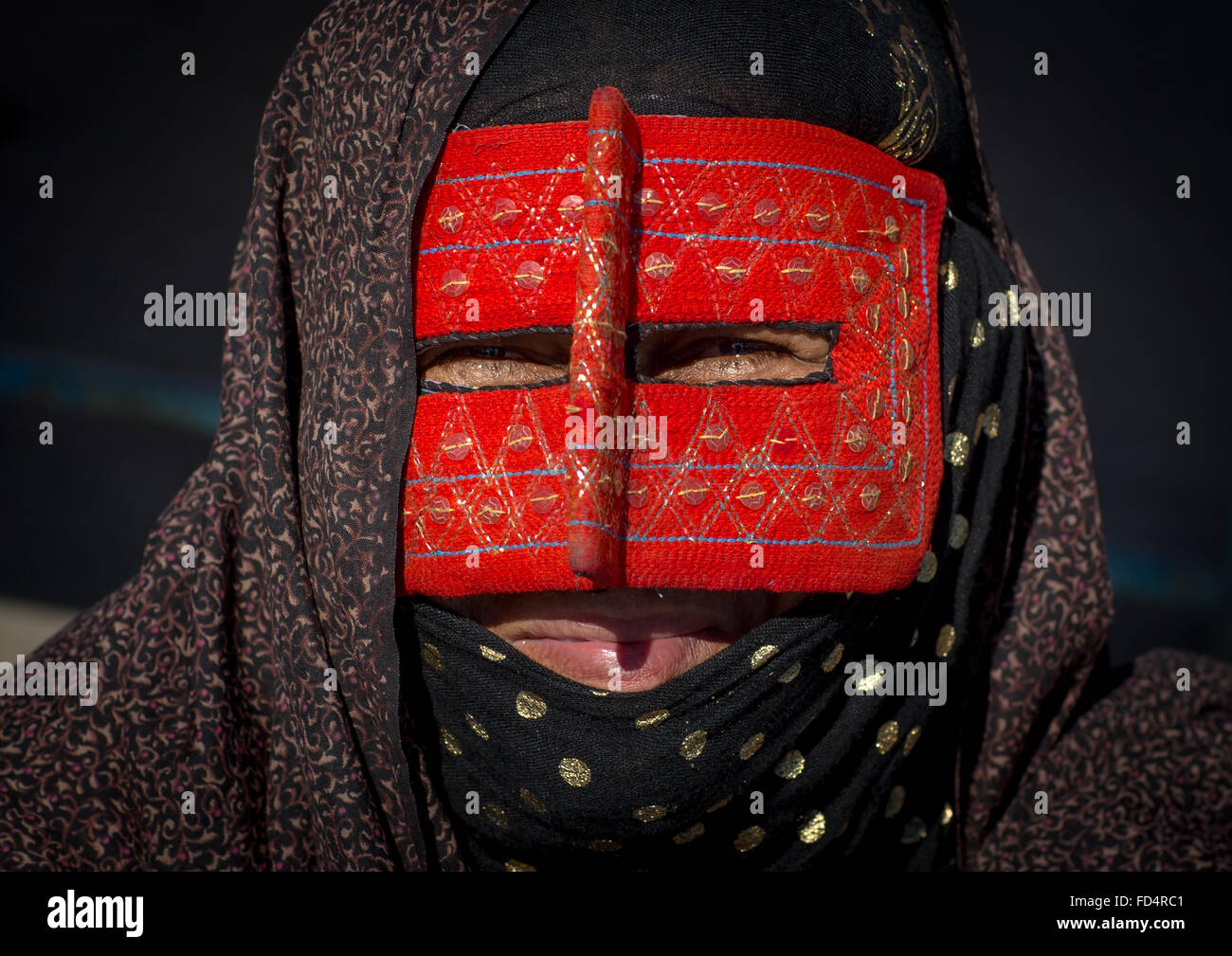 a bandari woman wearing the traditional mask called the burqa on a ...
