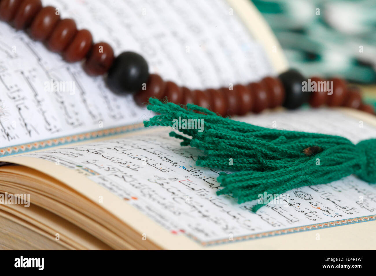 Islamic prayer beads and Quran Stock Photo - Alamy