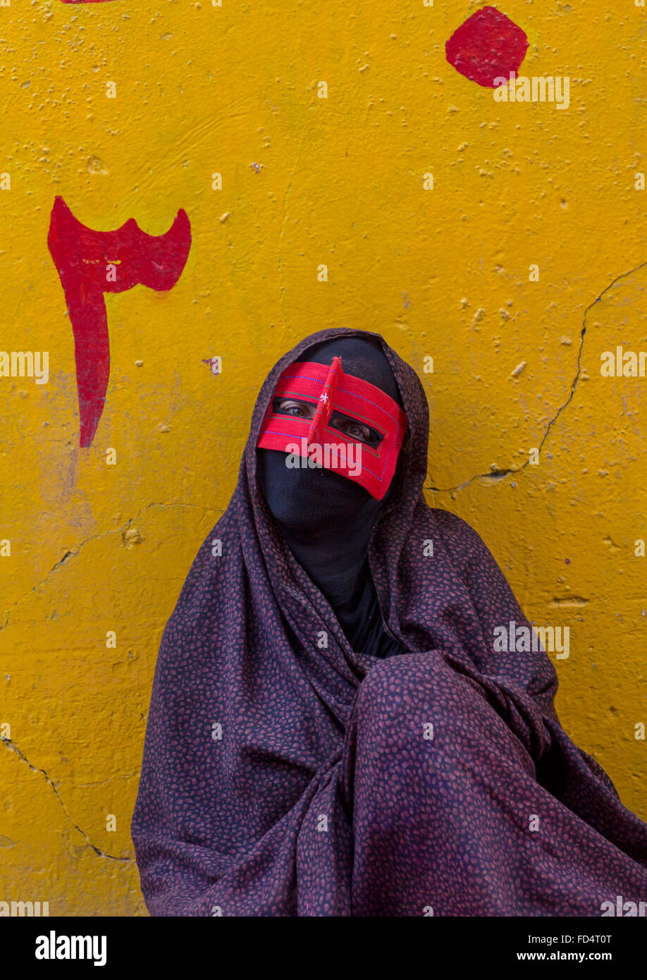 a bandari woman wearing the traditional mask called the burqa on a ...