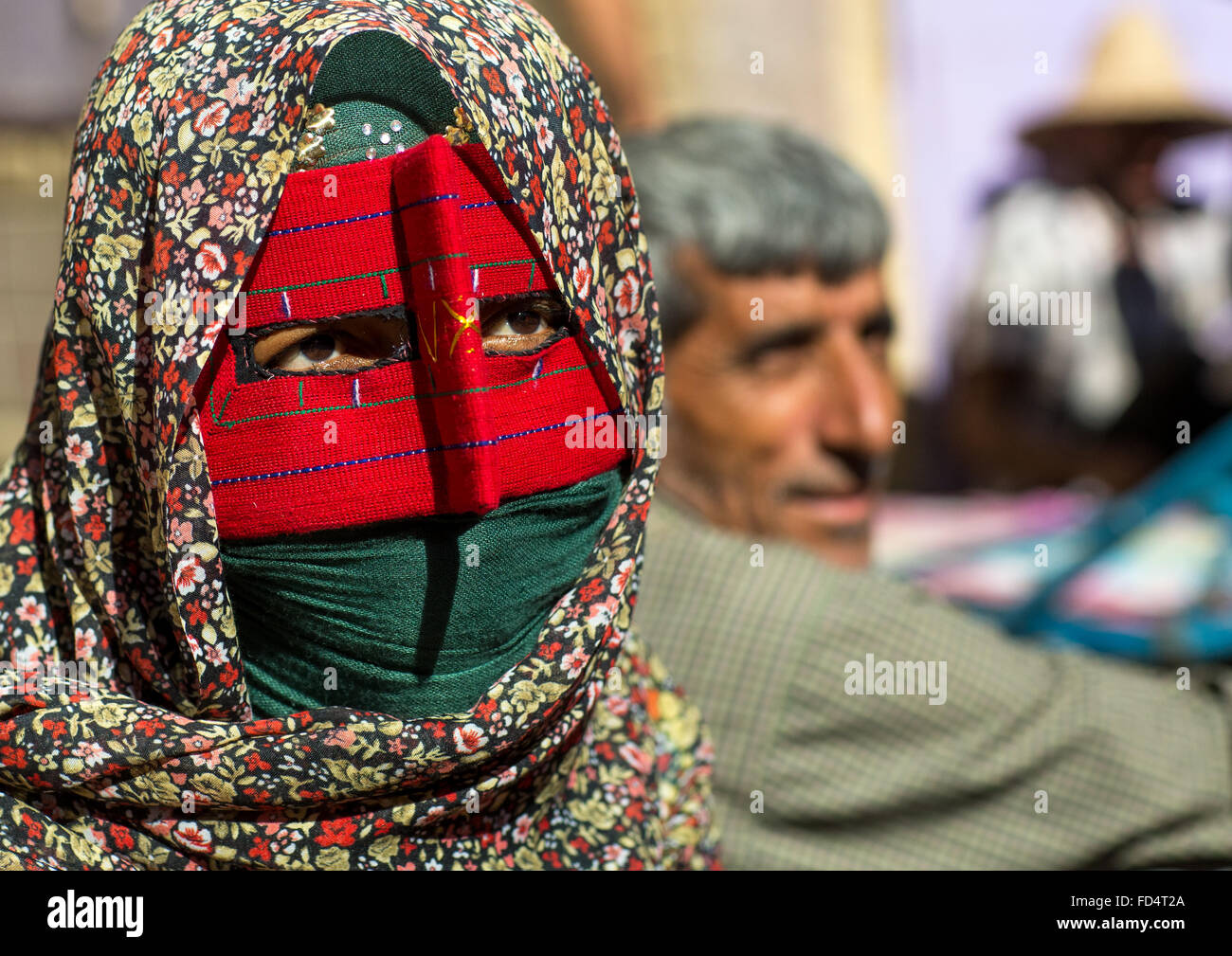 a bandari woman wearing the traditional mask called the burqa on a ...