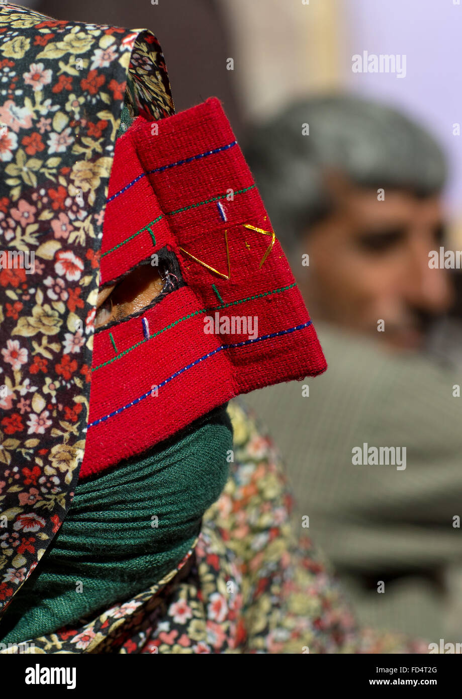 a bandari woman wearing the traditional mask called the burqa on a ...