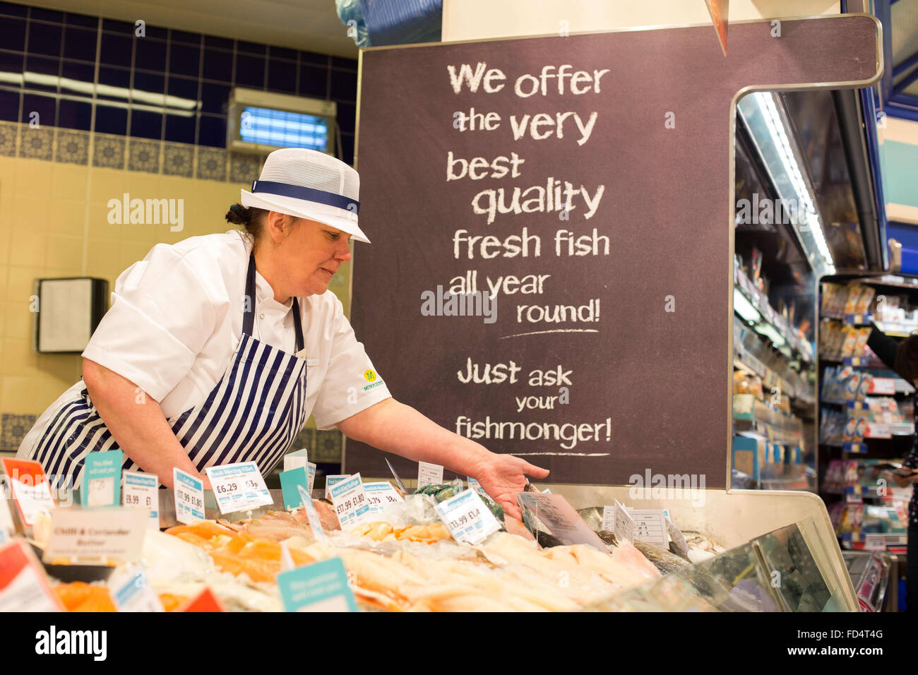 Morrisons supermarket. A woman works in the fishmongers section Stock ...