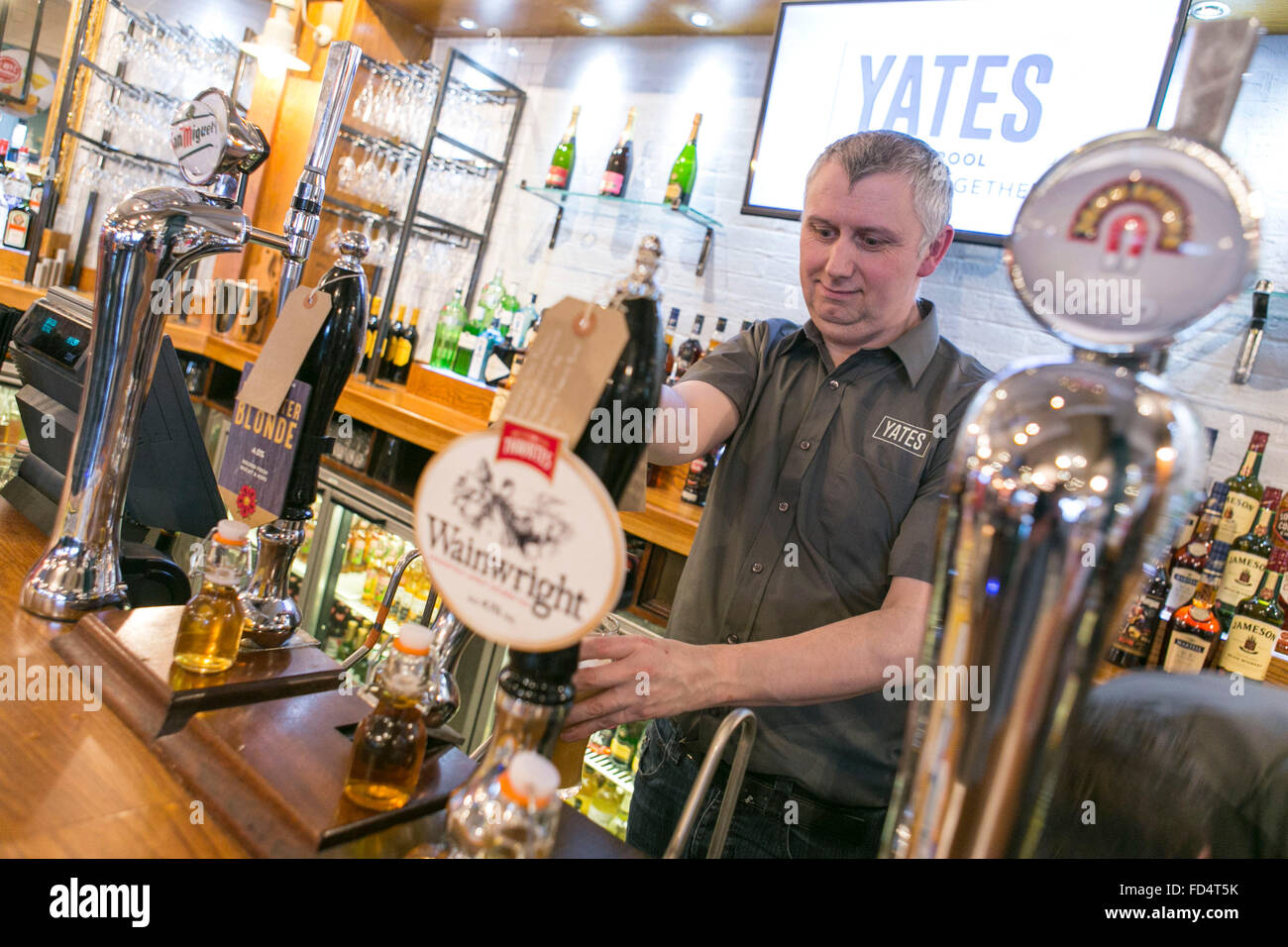 draught real ales for sale in a Yates Pub Stock Photo - Alamy