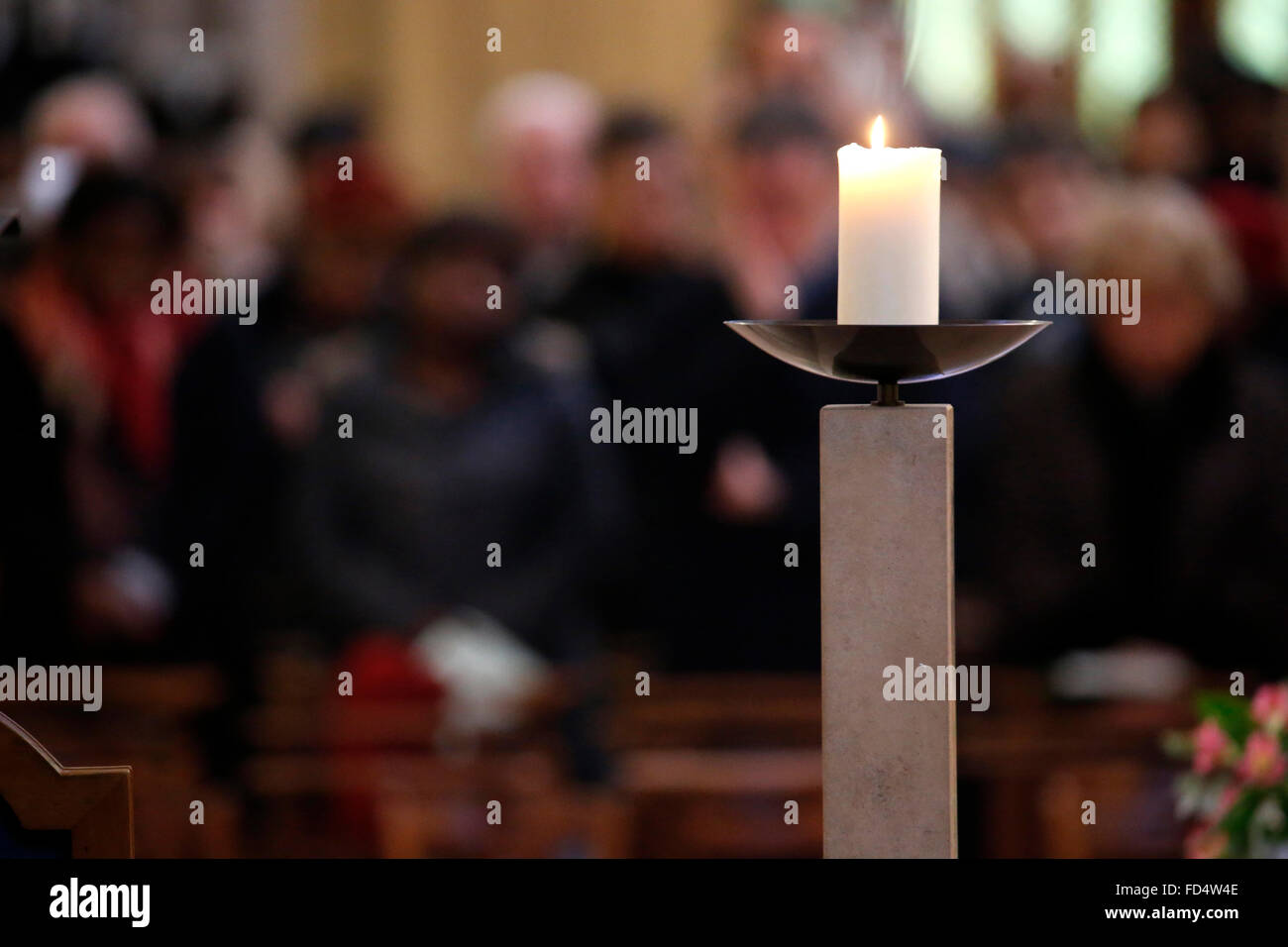 Catholic mass and church candle Stock Photo - Alamy